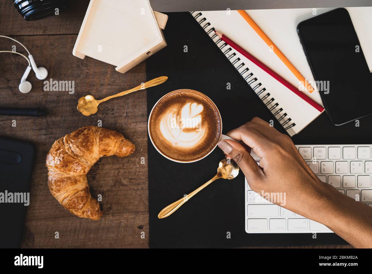 Latte coffee on the desk at home,A desk at home with coffee Stock Photo ...