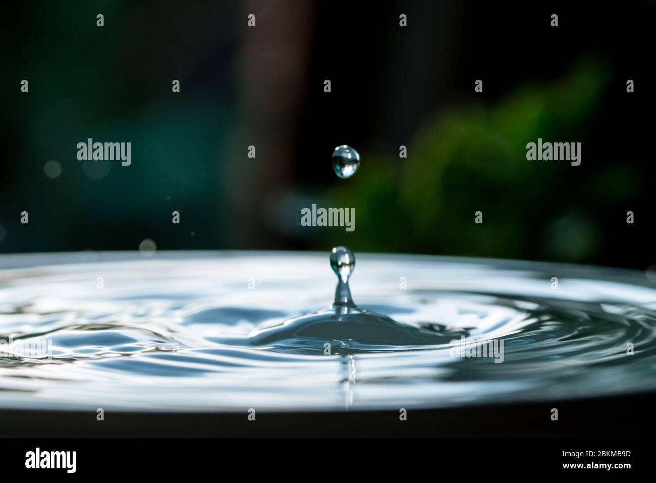 Water Drop splash with sun Stock Photo - Alamy