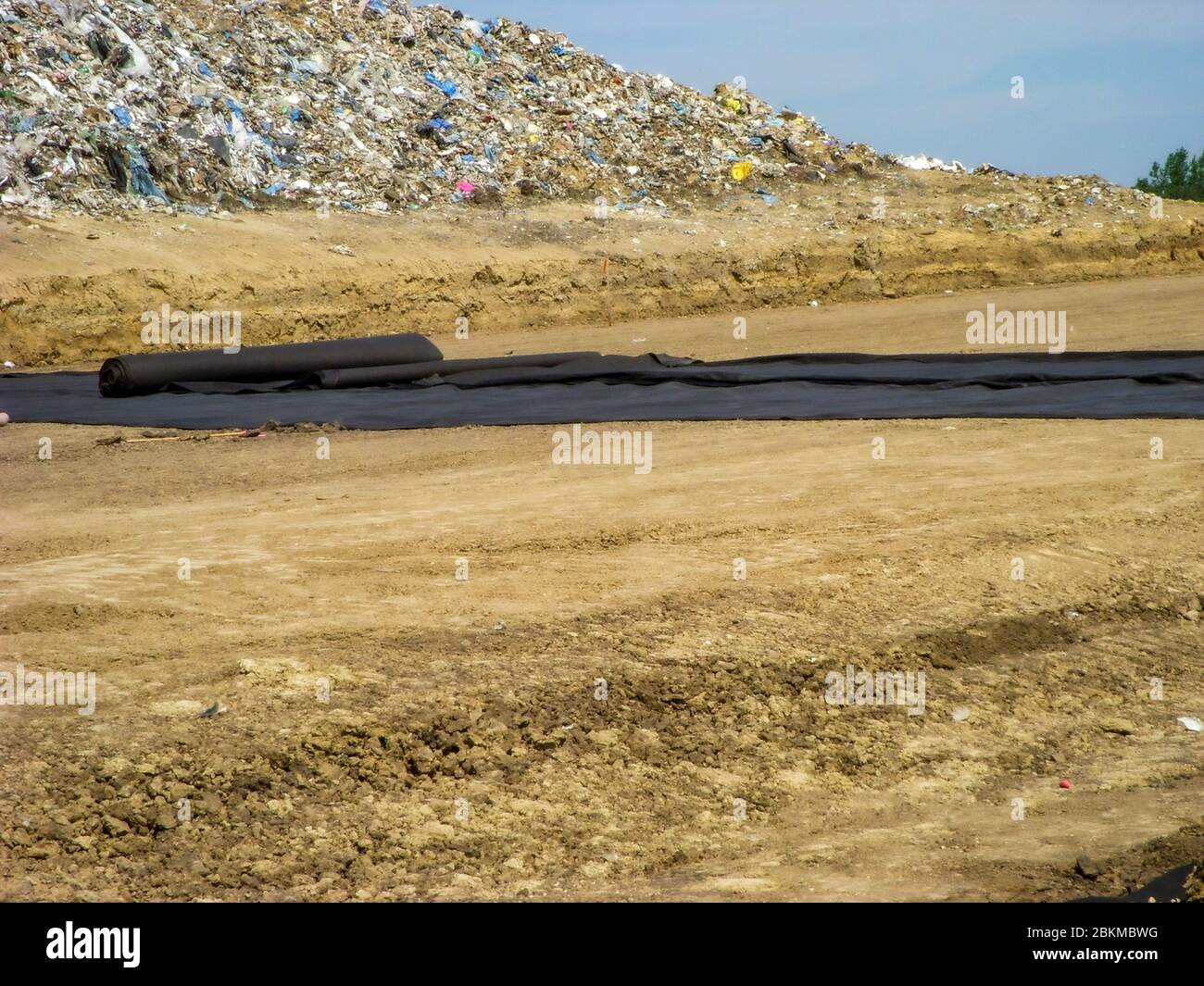 Working edge of a landfill expansion project with active landfill, clay ...