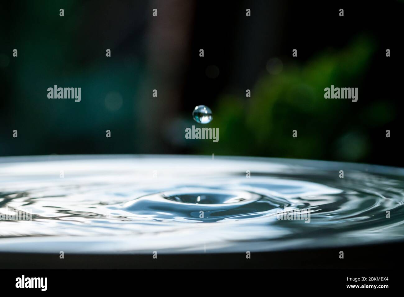 Water Drop splash with sun Stock Photo - Alamy