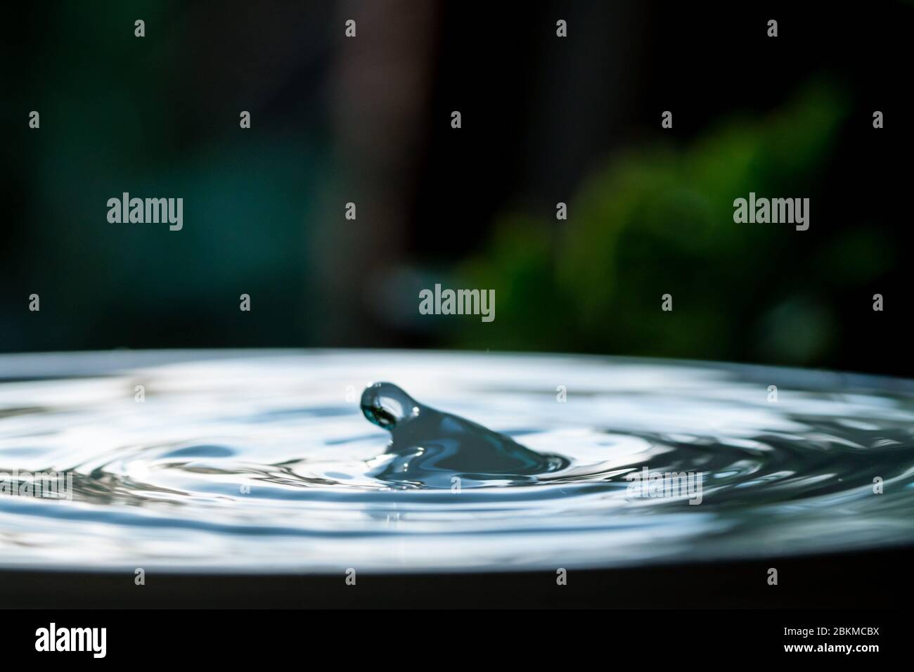 Water Drop splash with sun Stock Photo - Alamy