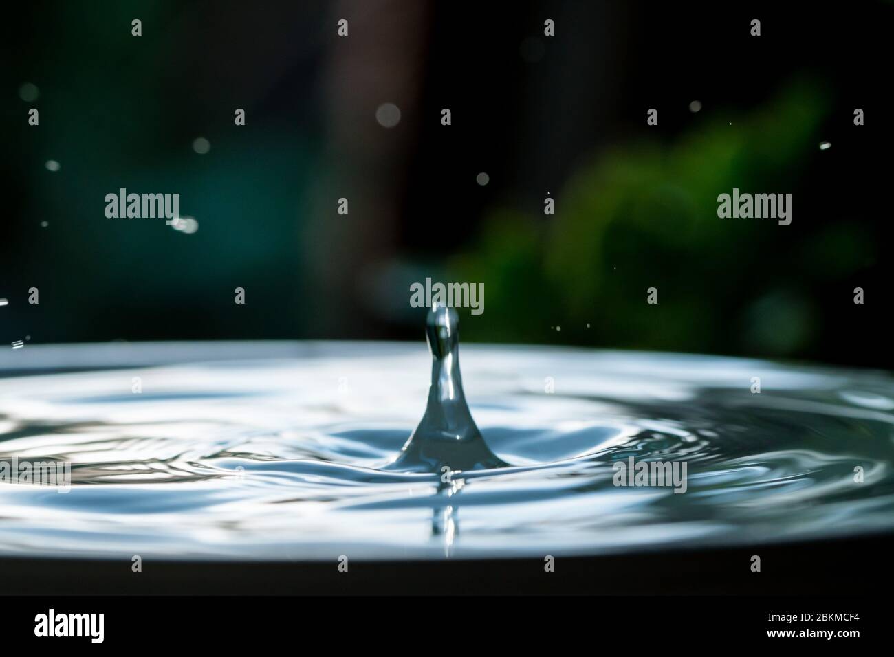 Water Drop splash with sun Stock Photo - Alamy