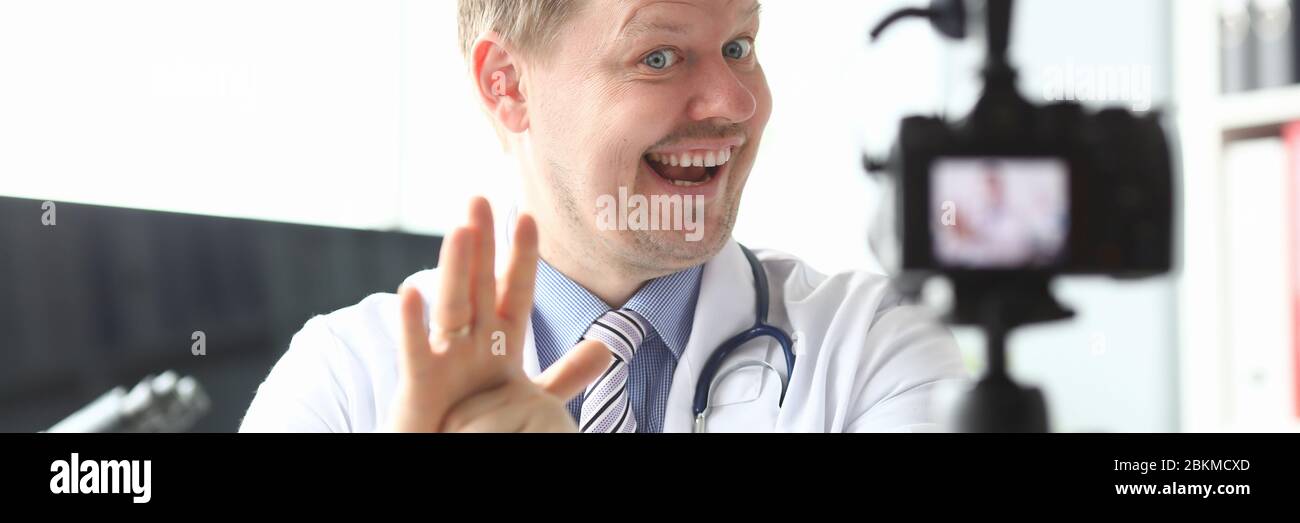 Doctor shoots video blog, explains sign language Stock Photo - Alamy