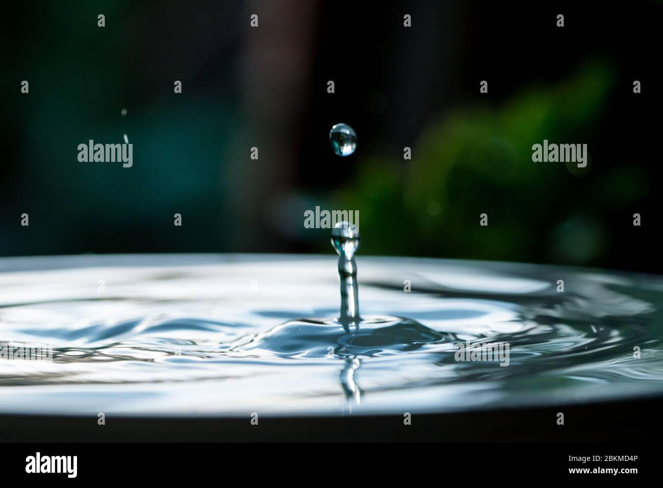 Water Drop splash with sun Stock Photo - Alamy
