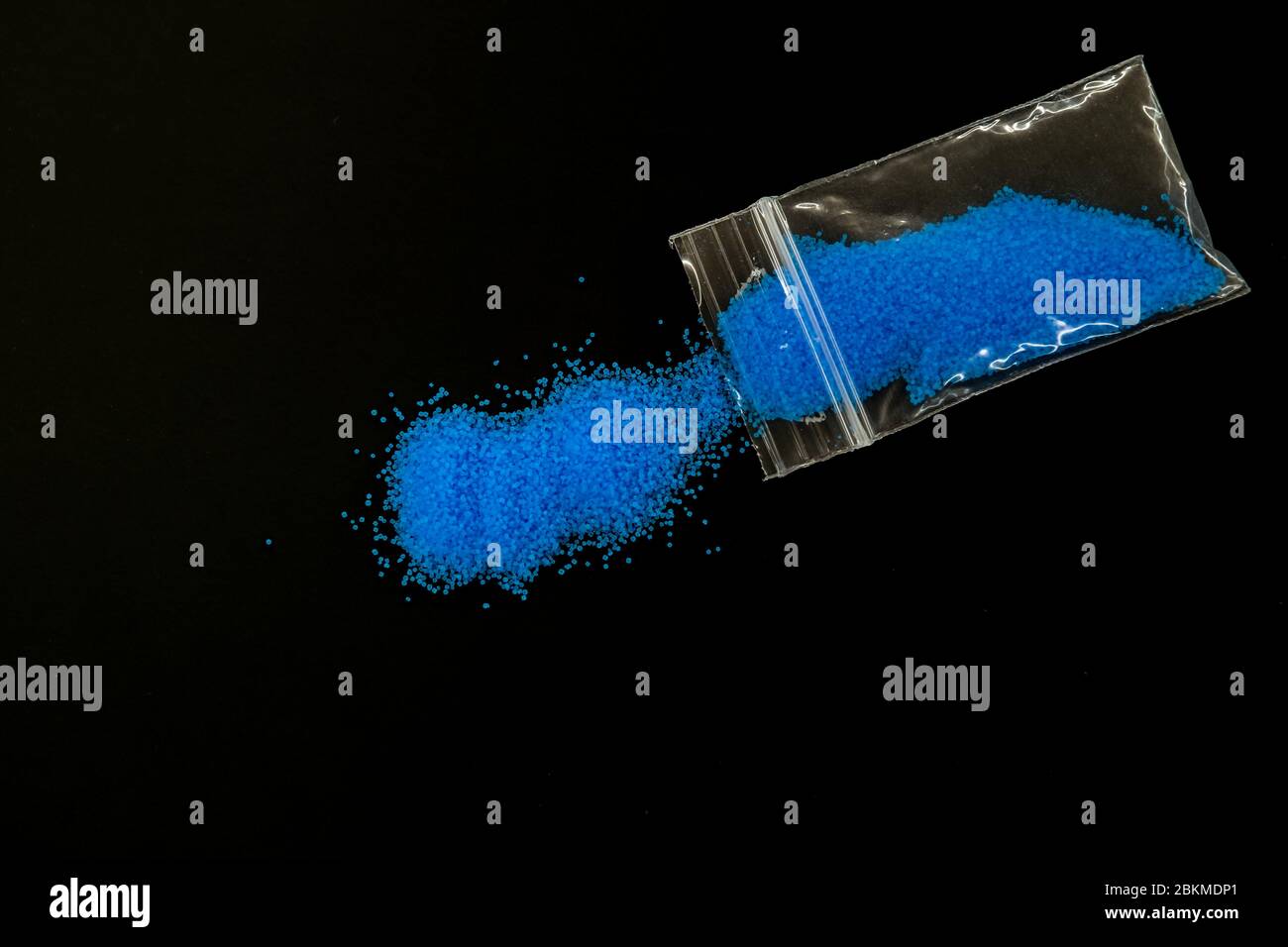 plastic envelope with blue drugs Stock Photo - Alamy