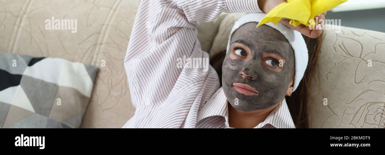 Exhausted lady resting on sofa Stock Photo - Alamy