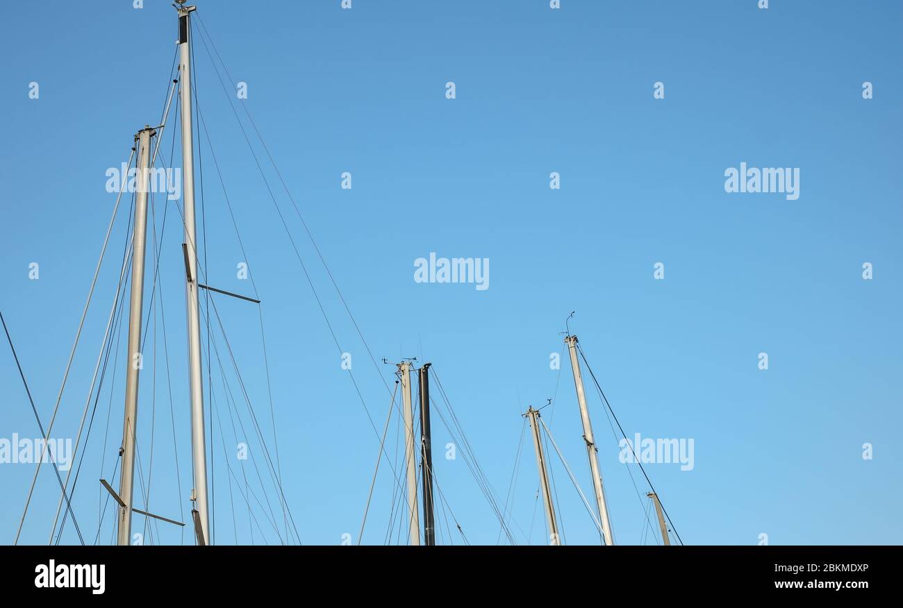 ship modern masts on blue sky Stock Photo - Alamy