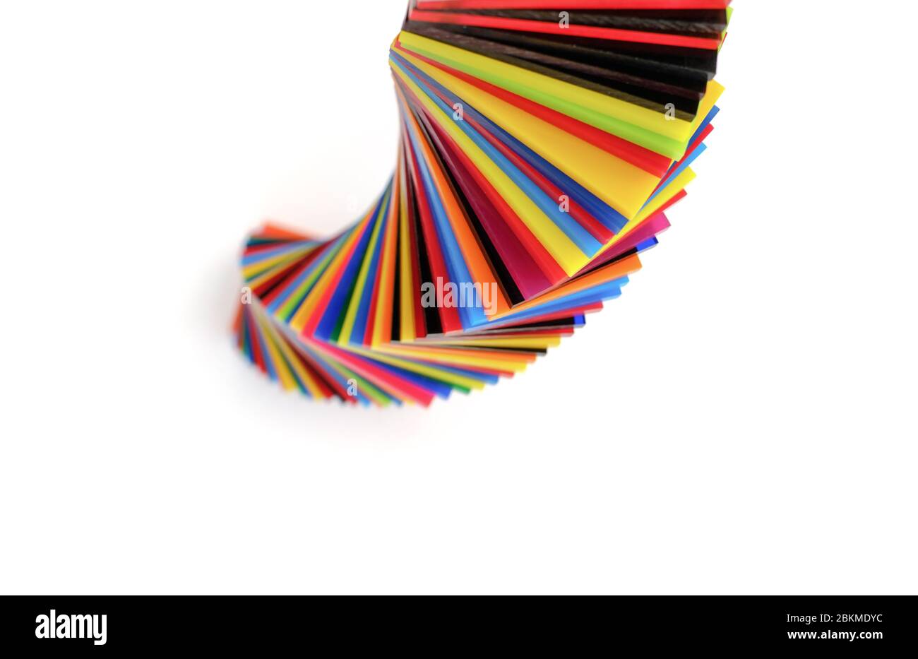 spiral Stack of different colours Cast Acrylic Sheet on white ...