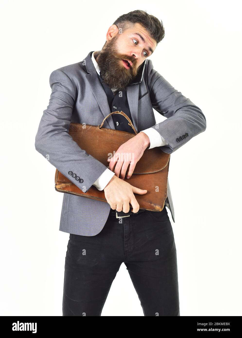 Busy man with briefcase talking by mobile phone isolated on white ...