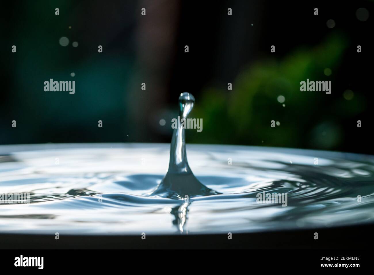 Water Drop splash with sun Stock Photo - Alamy