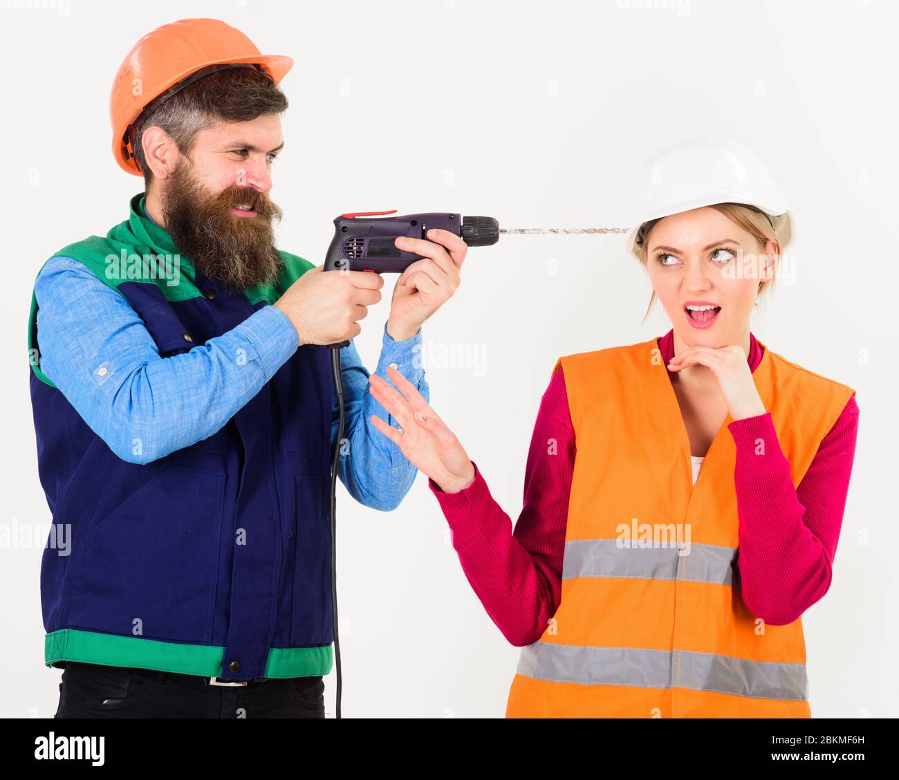 Woman with bored face in helmet, hard hat. Family making repair ...