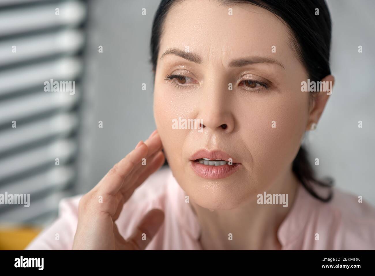 Hand near neck hi-res stock photography and images - Alamy