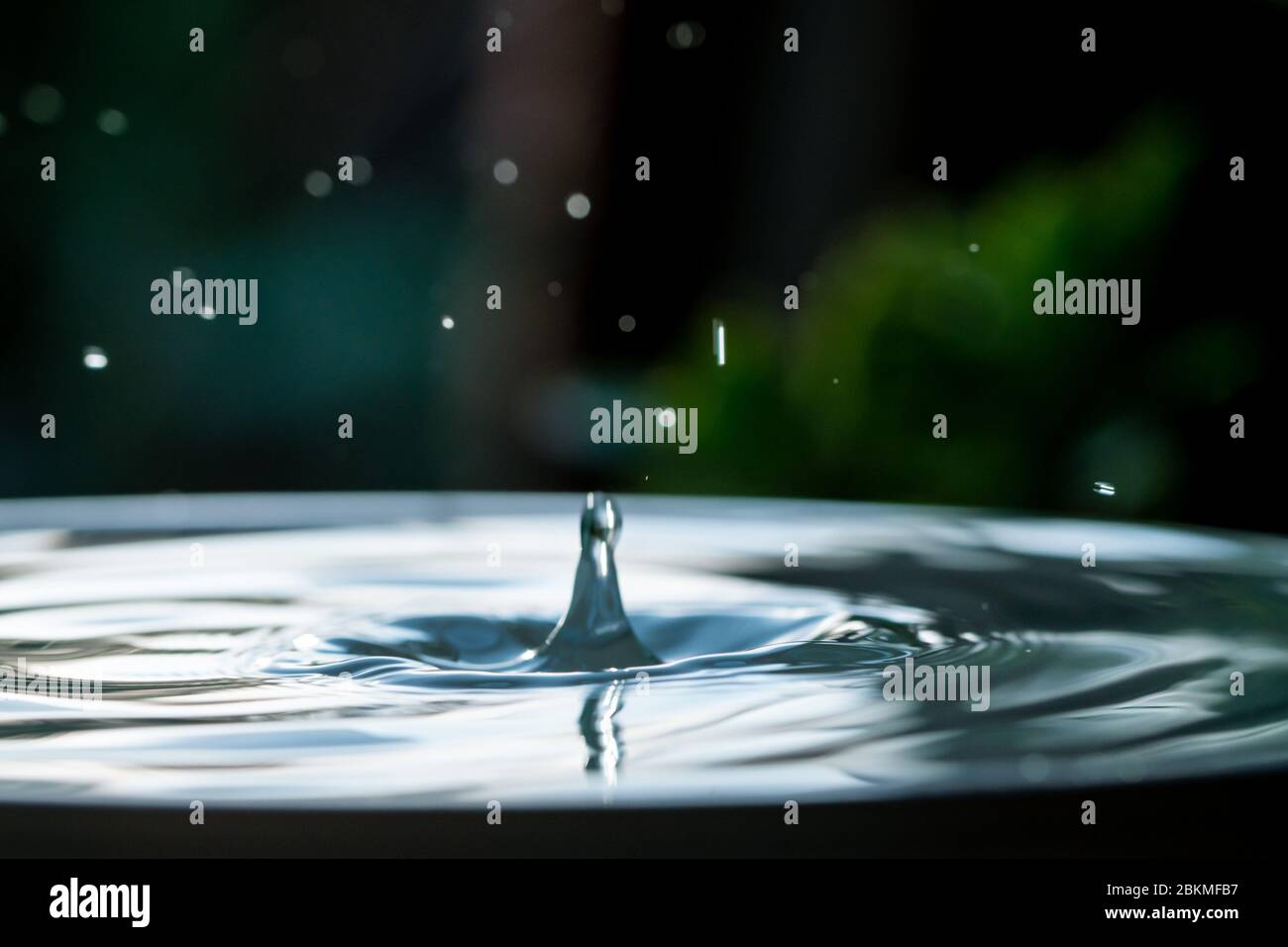 Water Drop splash with sun Stock Photo - Alamy