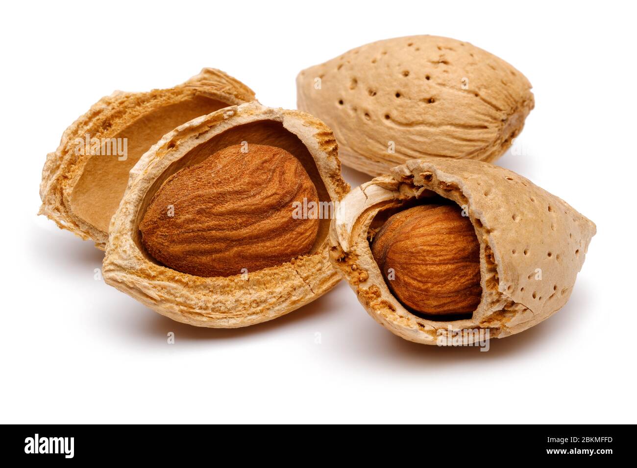 Cracked and whole almonds isolated on white background. Macro, studio ...