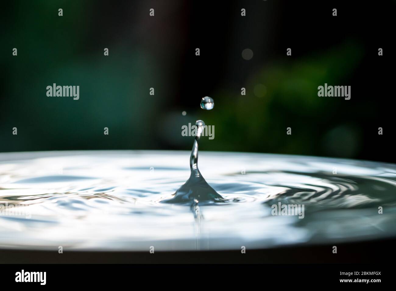 Water Drop splash with sun Stock Photo - Alamy