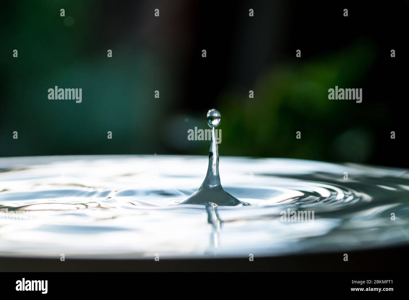 Water Drop splash with sun Stock Photo - Alamy