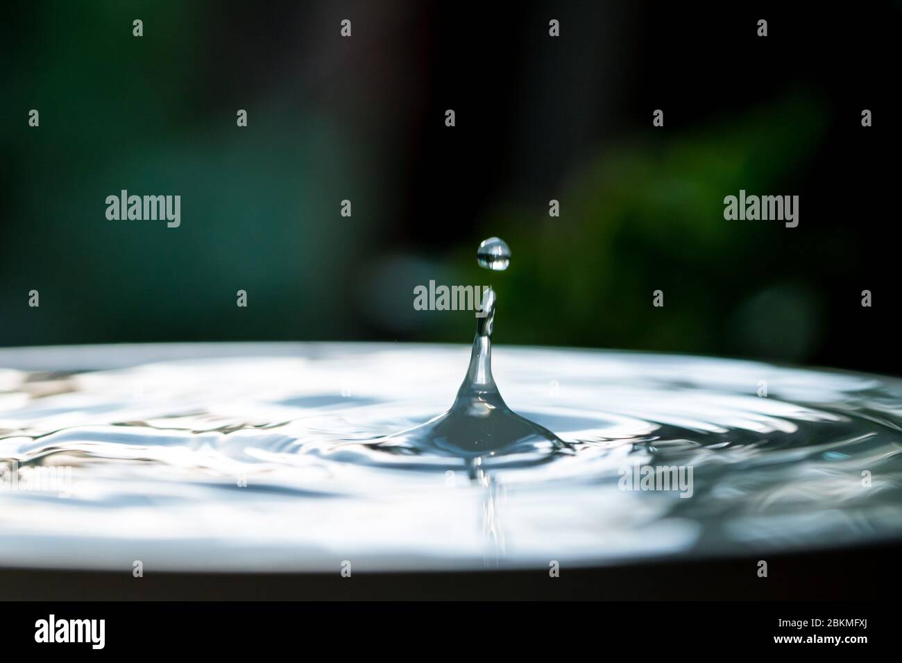 Water Drop splash with sun Stock Photo - Alamy