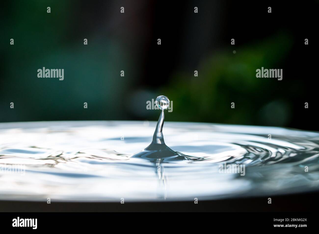 Water Drop splash with sun Stock Photo - Alamy