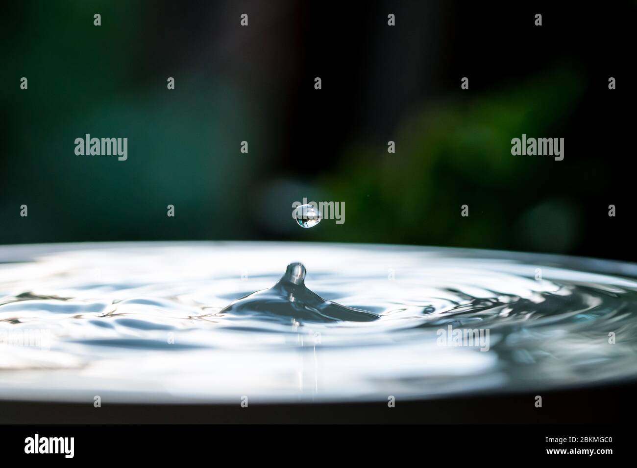 Water Drop splash with sun Stock Photo - Alamy