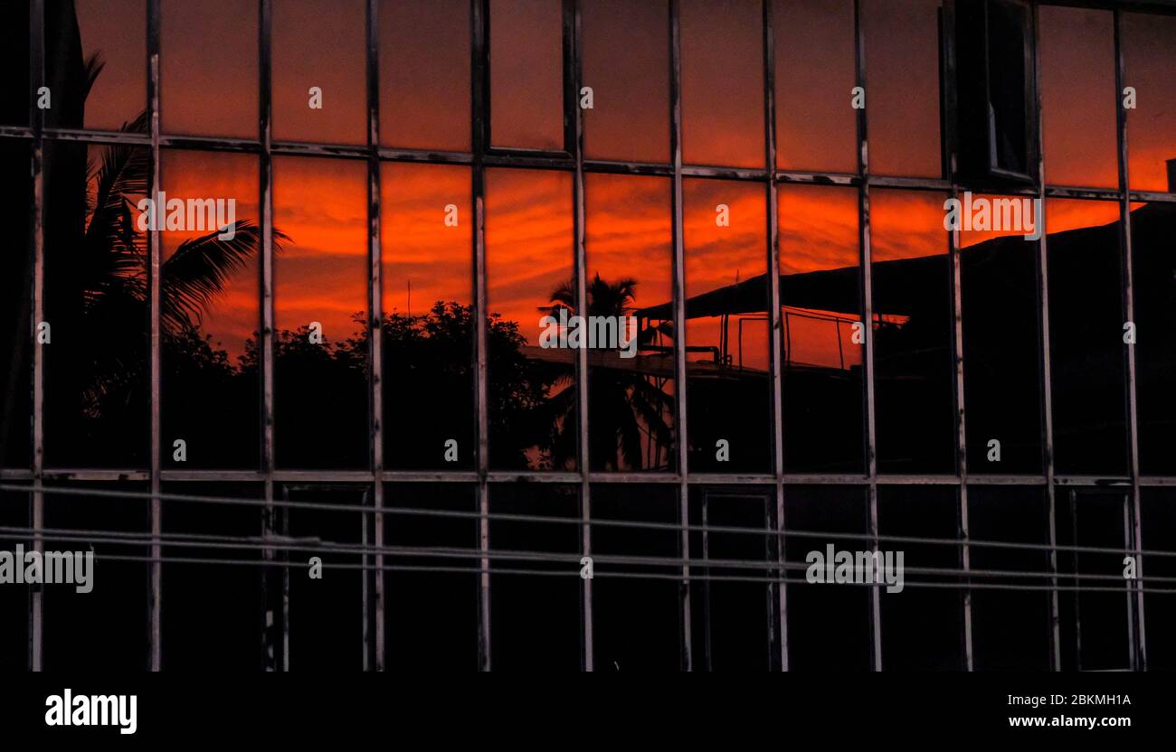 Sunset reflected in a window Stock Photo - Alamy