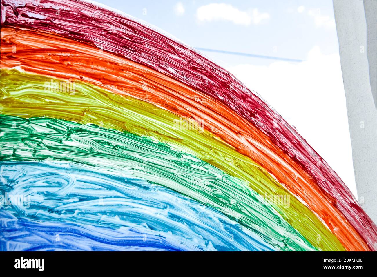 let's all be well. public flashmob children paint a rainbow on the ...