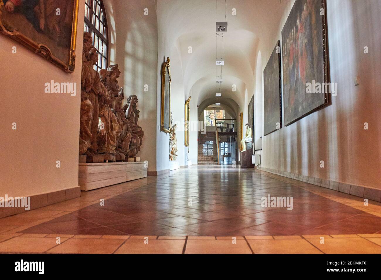 Corridor in art gallery with some paintings on the wall Stock Photo - Alamy