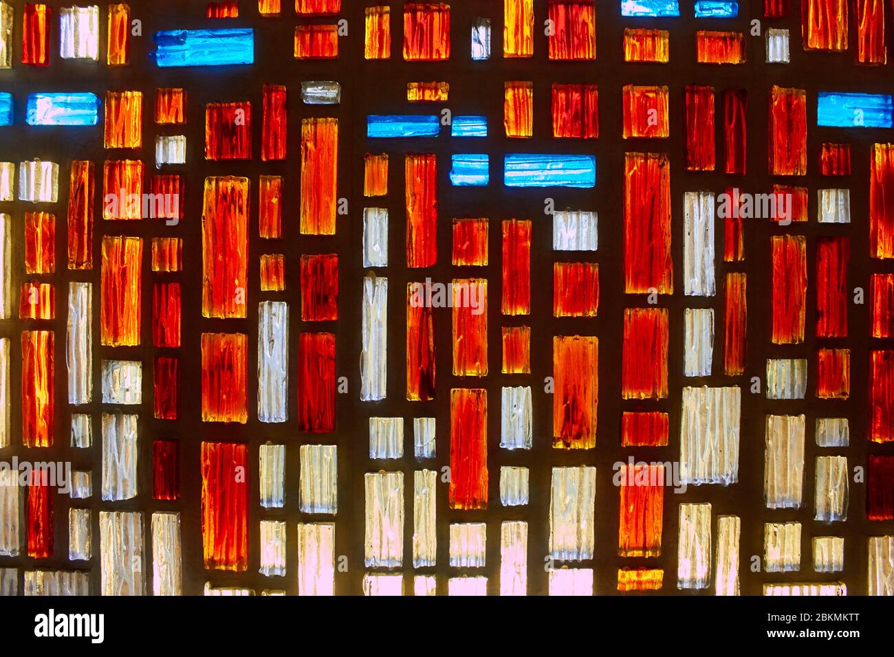 Stained glass window with many red parts Stock Photo - Alamy