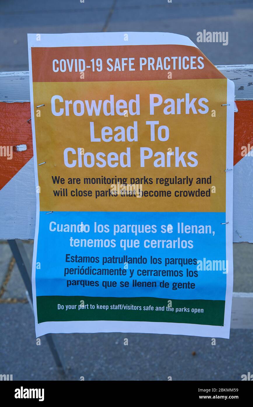 A health notice cautions public to abide by social distancing and ...