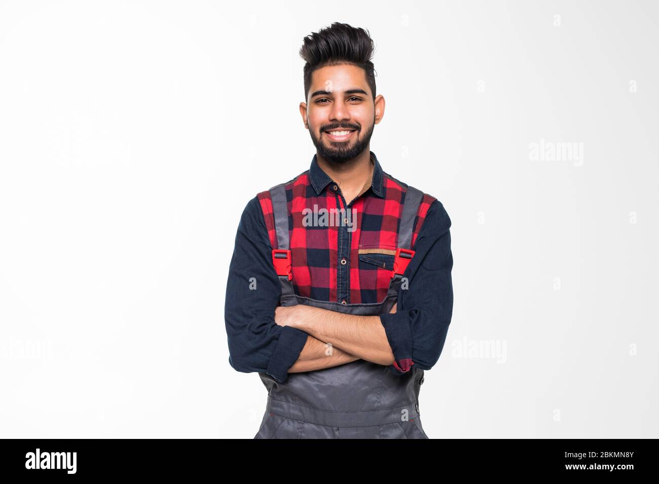 Portrait of smiling worker in blue uniform isolated on white background ...