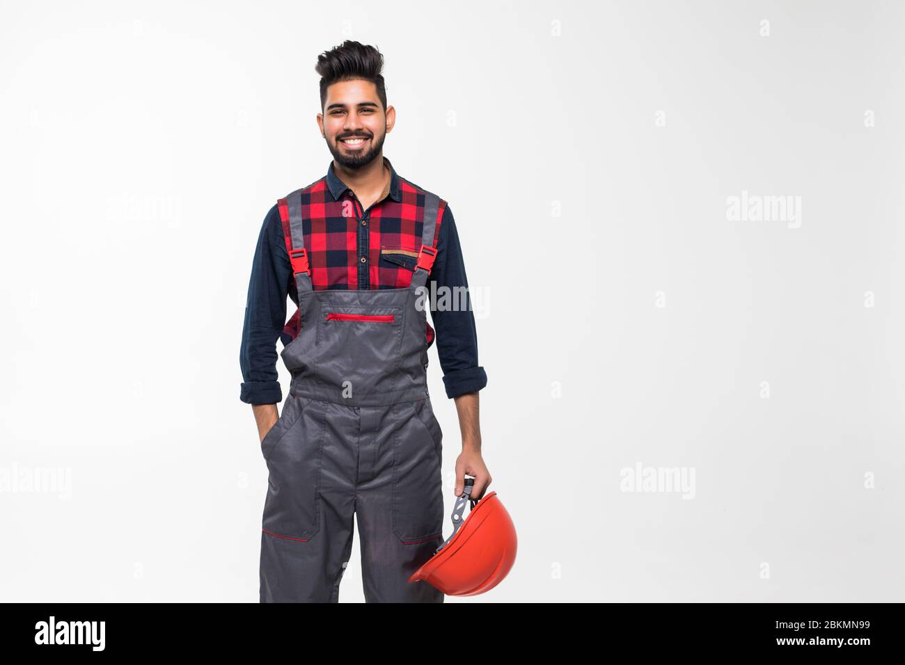 Handsome smiling contractor. Isolated over white background Stock Photo ...