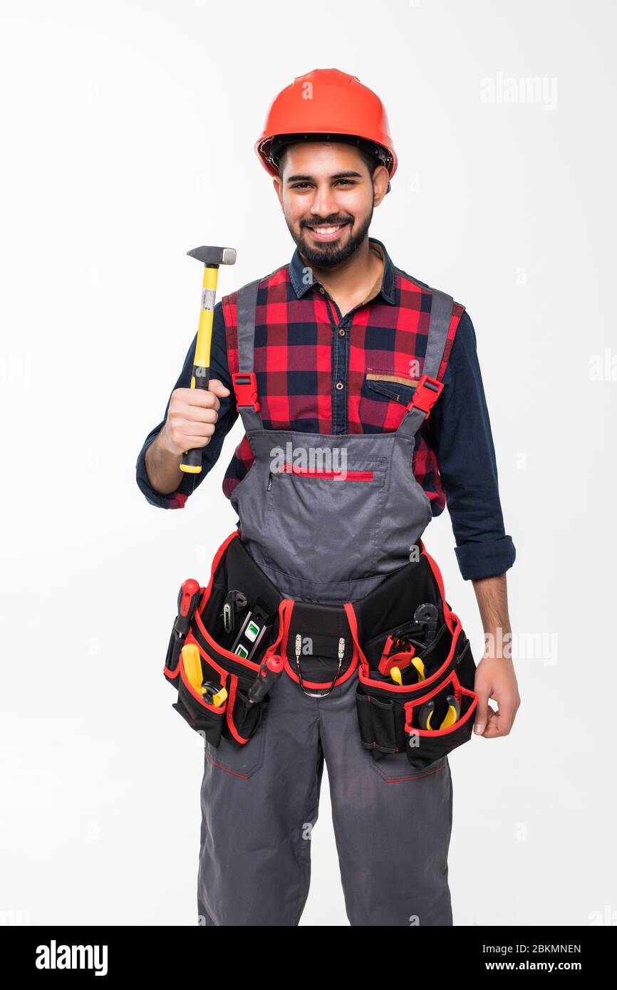 Full length portrait of a male manual worker working with hammer ...