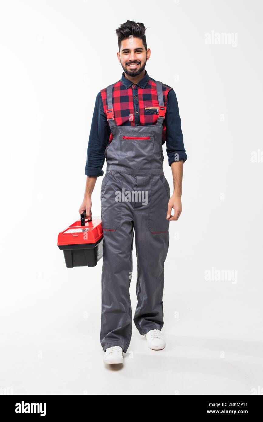 indian man holding a red tool box isolated on white background Stock ...