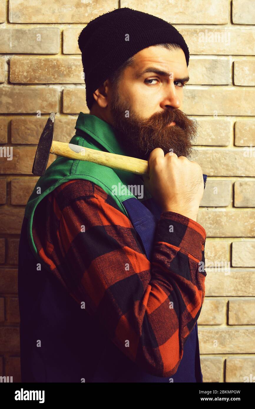 bearded builder man, long beard, brutal caucasian hipster with ...