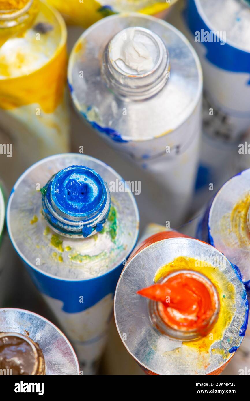 Close-up of an artists oil paint tubes open and used. Art and craft ...