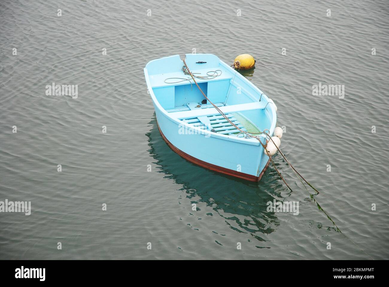 small light blue boat on the water Stock Photo - Alamy