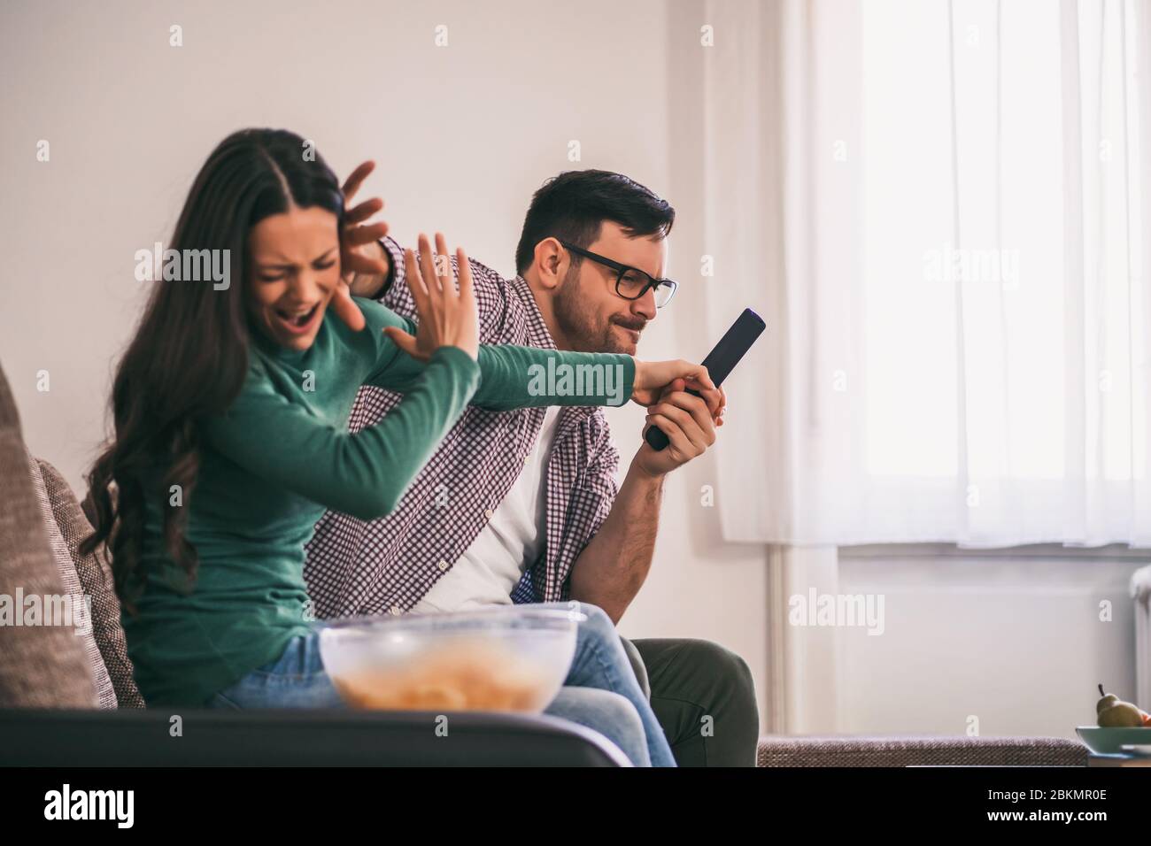 Couple arguing home tv hi-res stock photography and images - Alamy