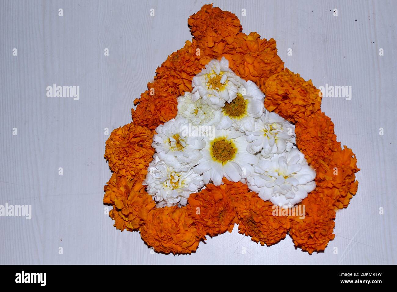 marigold and chrysanthemum flower love heart shape design, rangoli ...