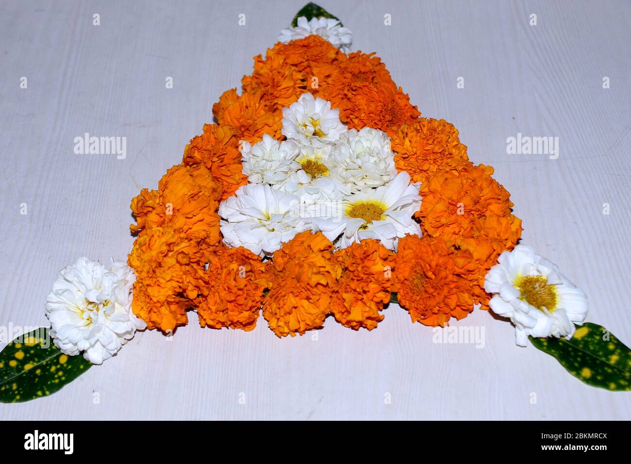 Beautiful triangle flower design with marigold, chrysanthemum flower ...