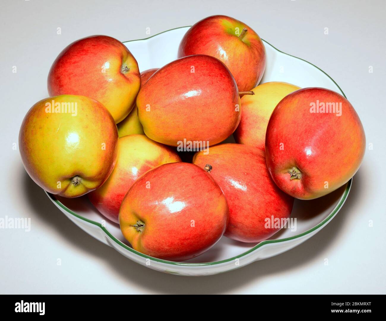 Jazz apples in a bowl against a white background, UK Stock Photo - Alamy