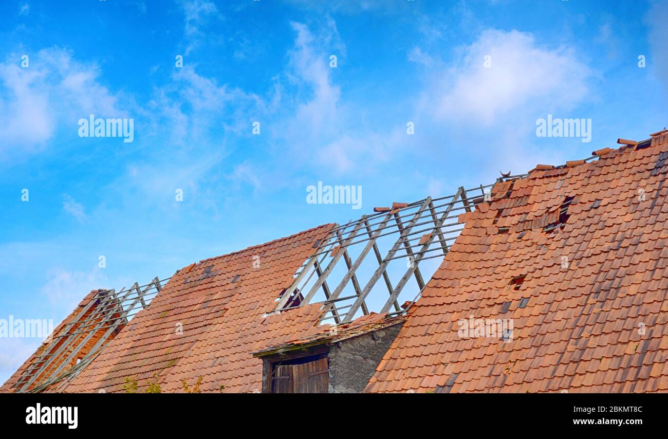 damaged roof after a storm Stock Photo - Alamy