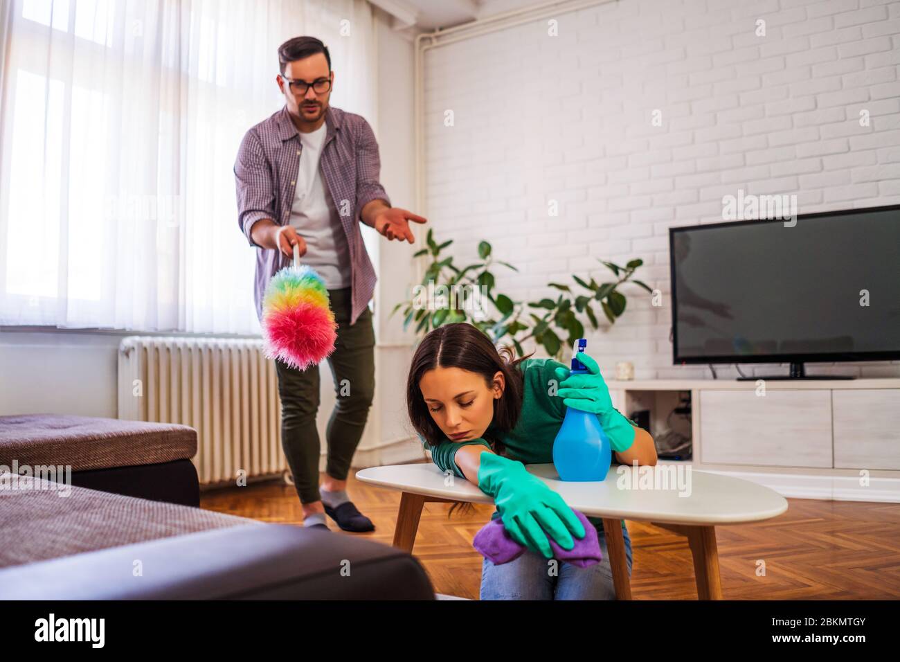 Lazy woman is refusing to clean the apartment Stock Photo - Alamy