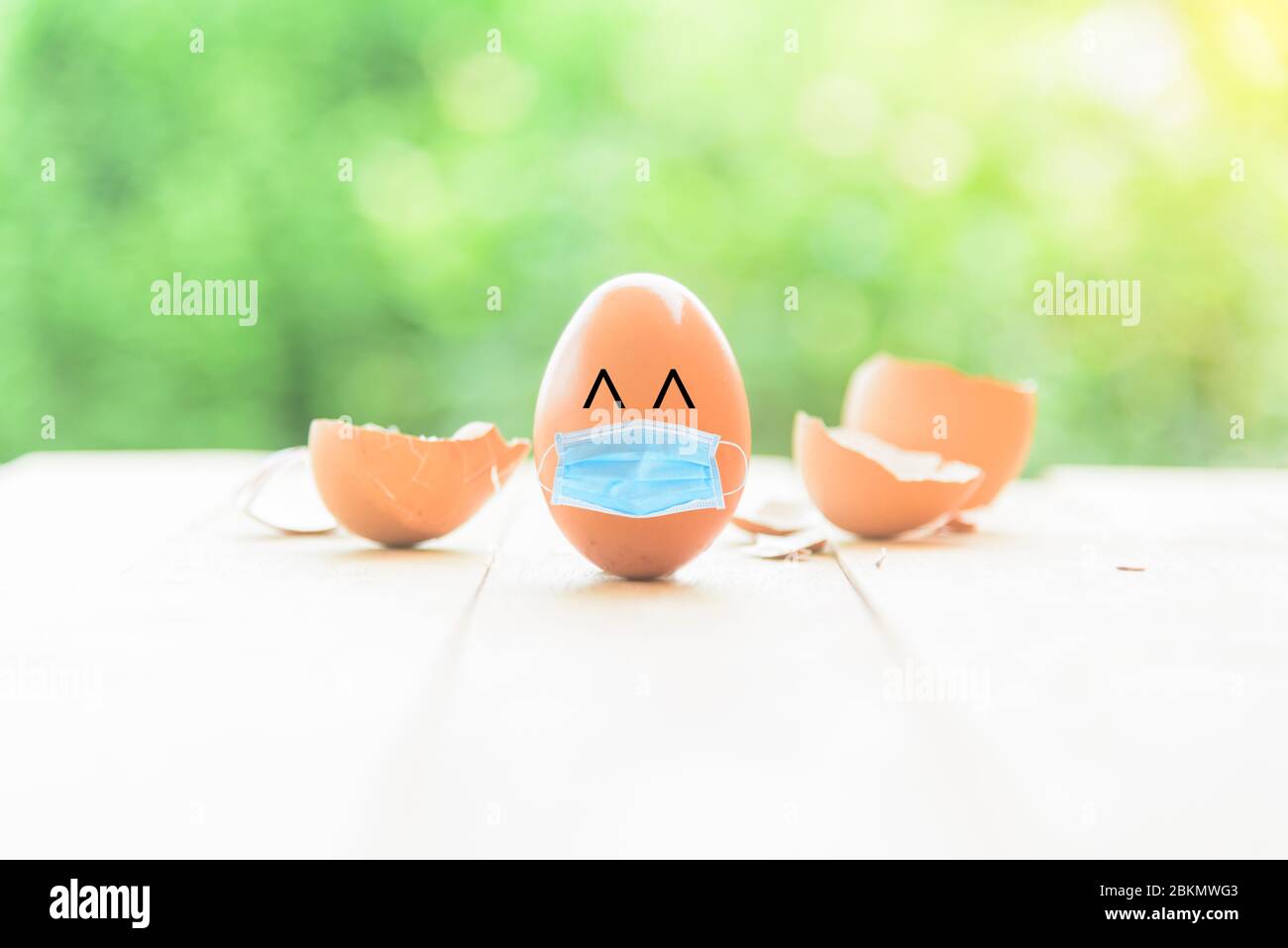 Egg wear the hygienic mask and Broken Egg shell background / safe egg ...