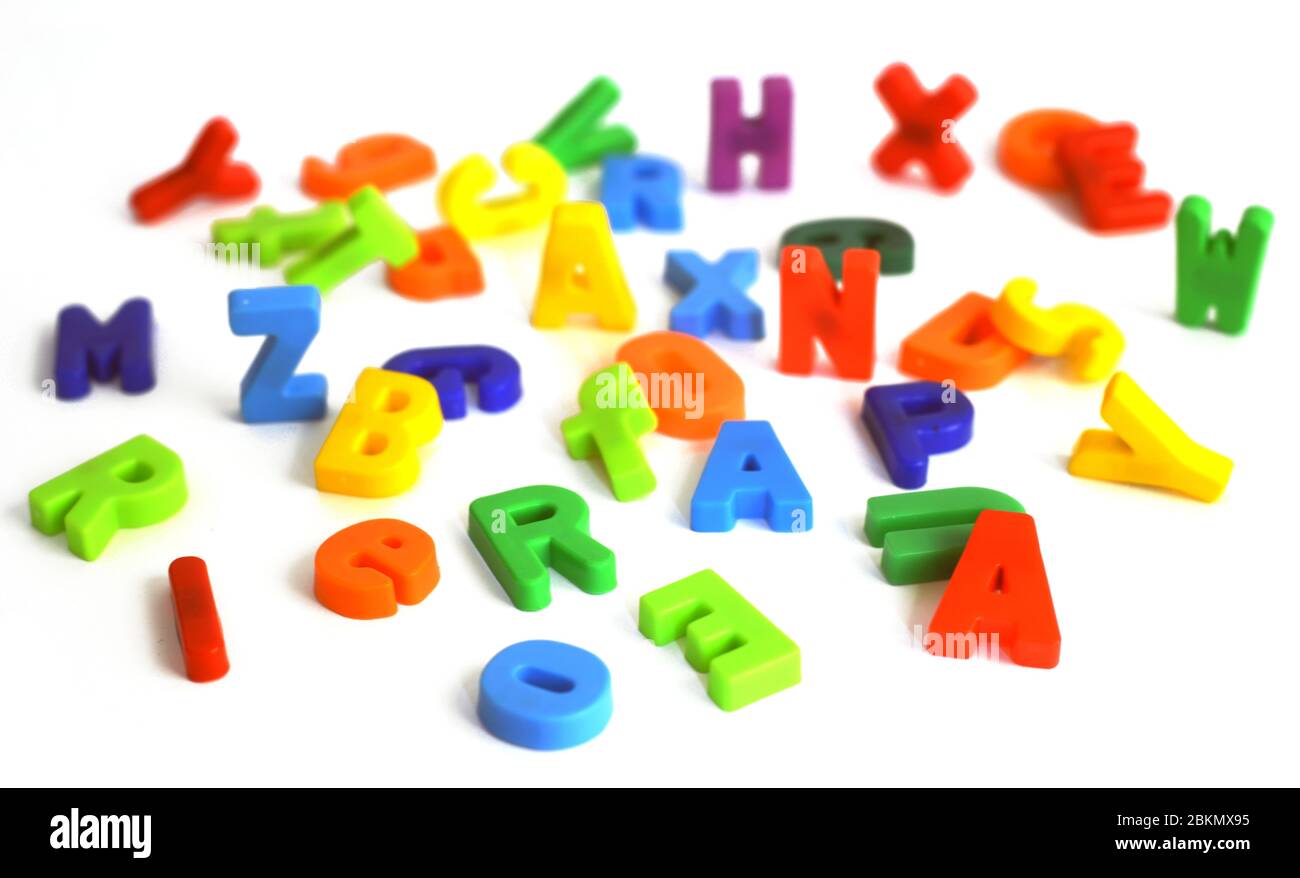 magnetic letters lying isolated on the ground Stock Photo - Alamy