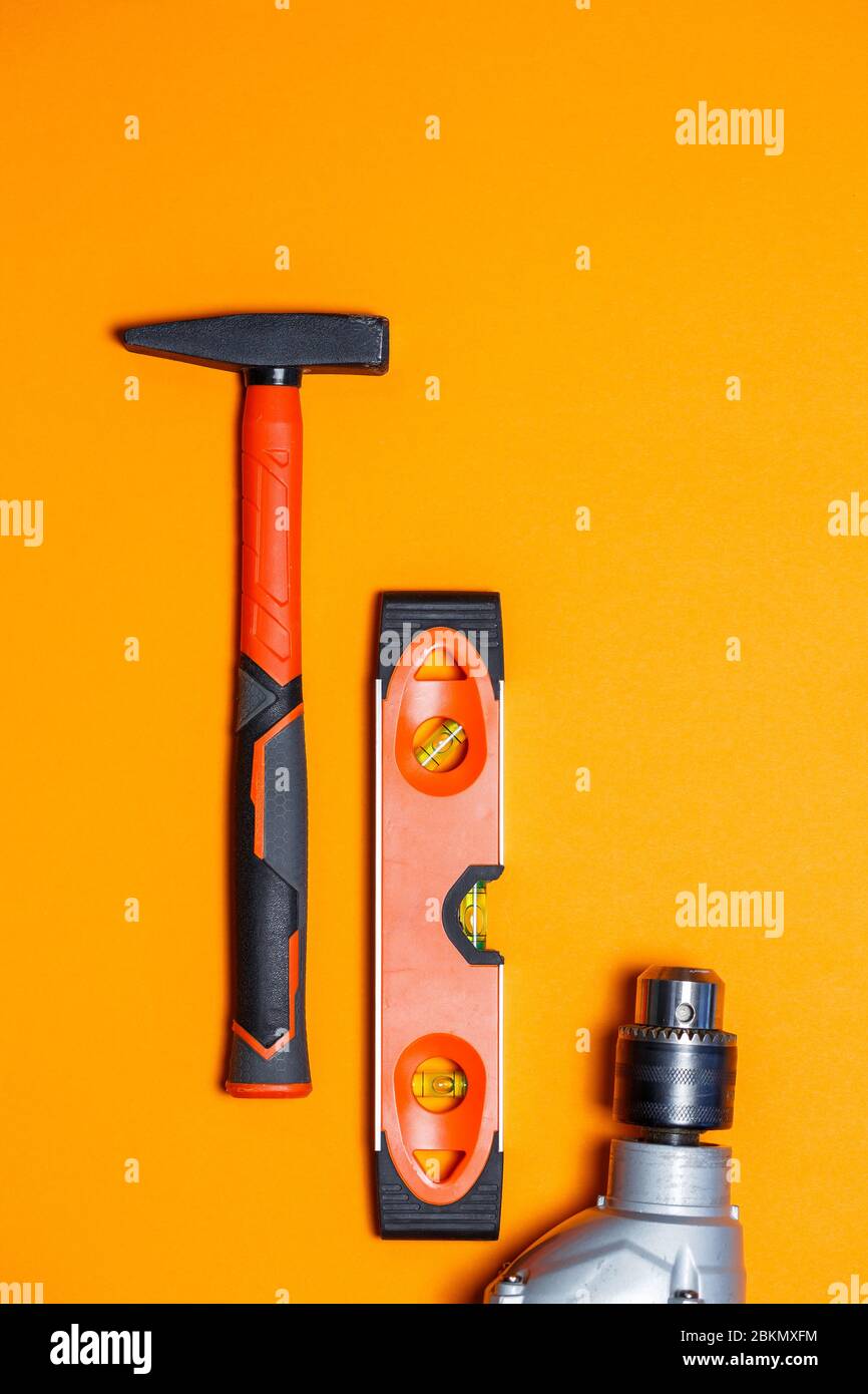 Tools for repairing home use. Hammer for nails, level and drill on an ...