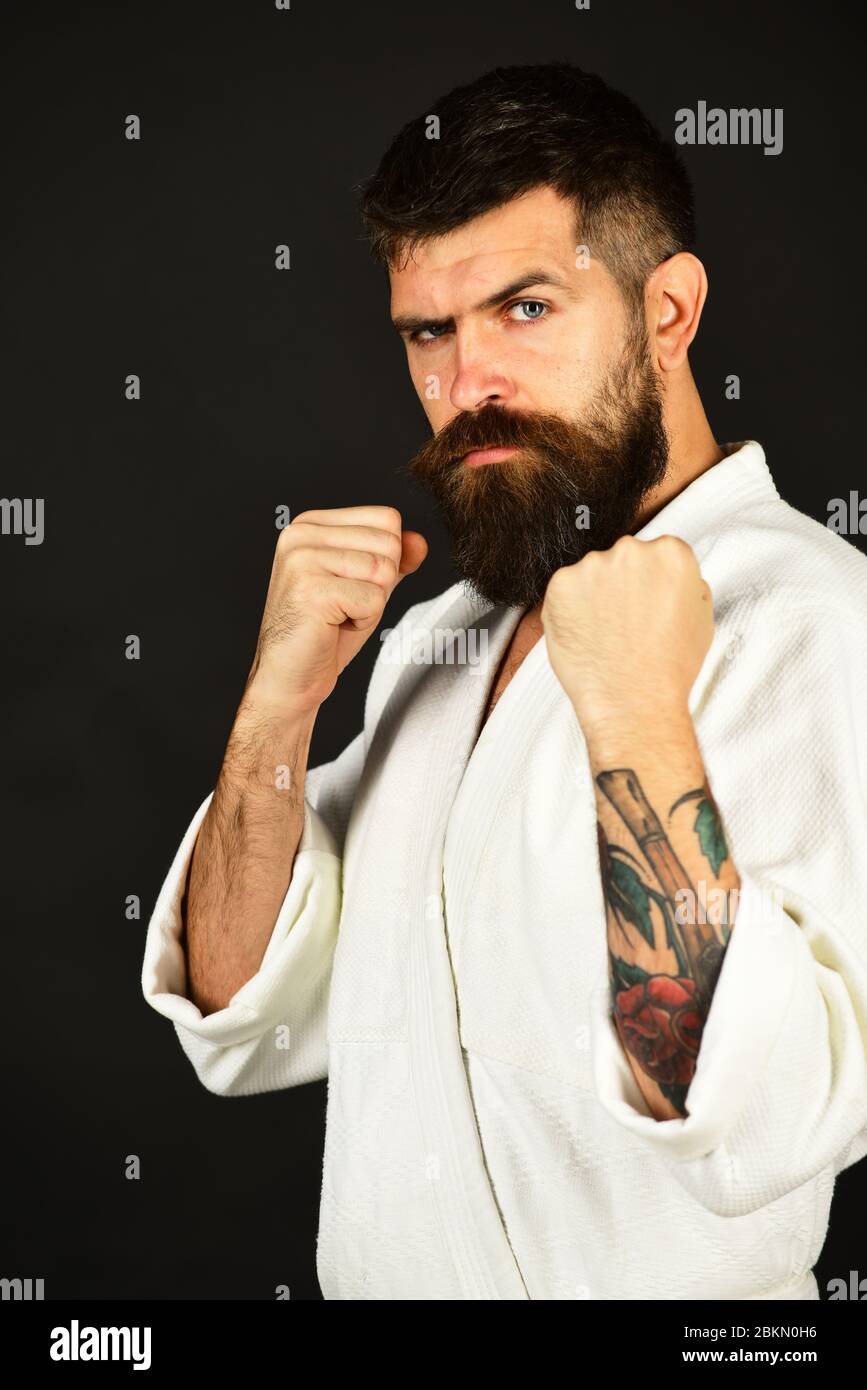 Jiu Jitsu master practices attack or defense posture. Karate man with ...