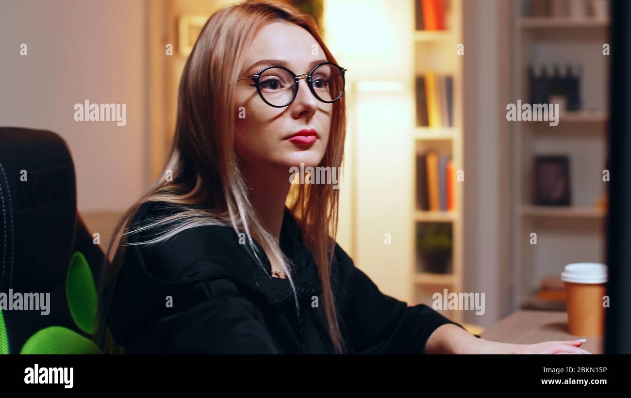 Close up of beautiful girl hacker using modern software to attack the ...