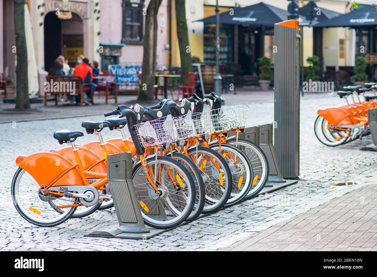 Sustainable transport. Row of bikes parked for hire in the old town ...