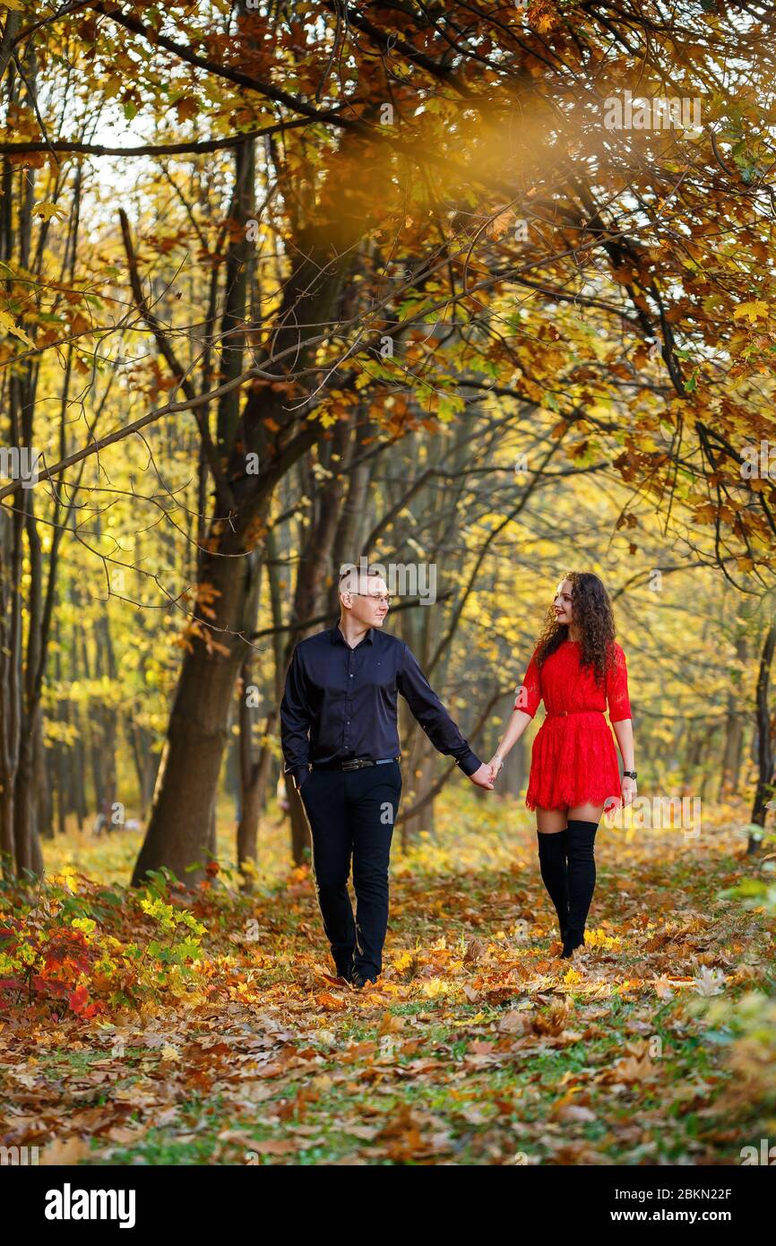 Beautiful couple in the autumn forest Stock Photo - Alamy