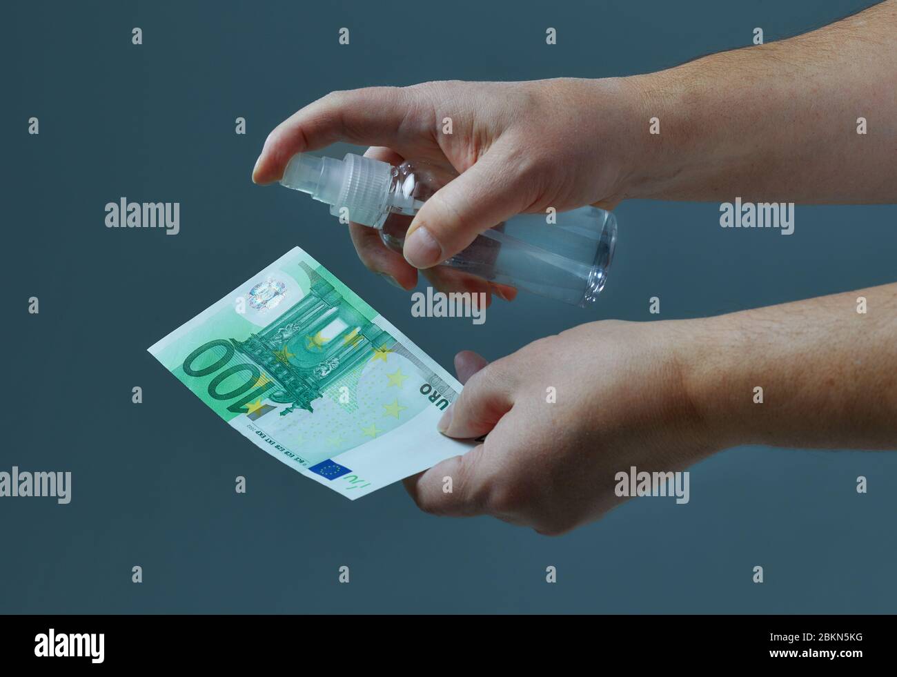 disinfection of money, banknote of 100 euros Stock Photo - Alamy