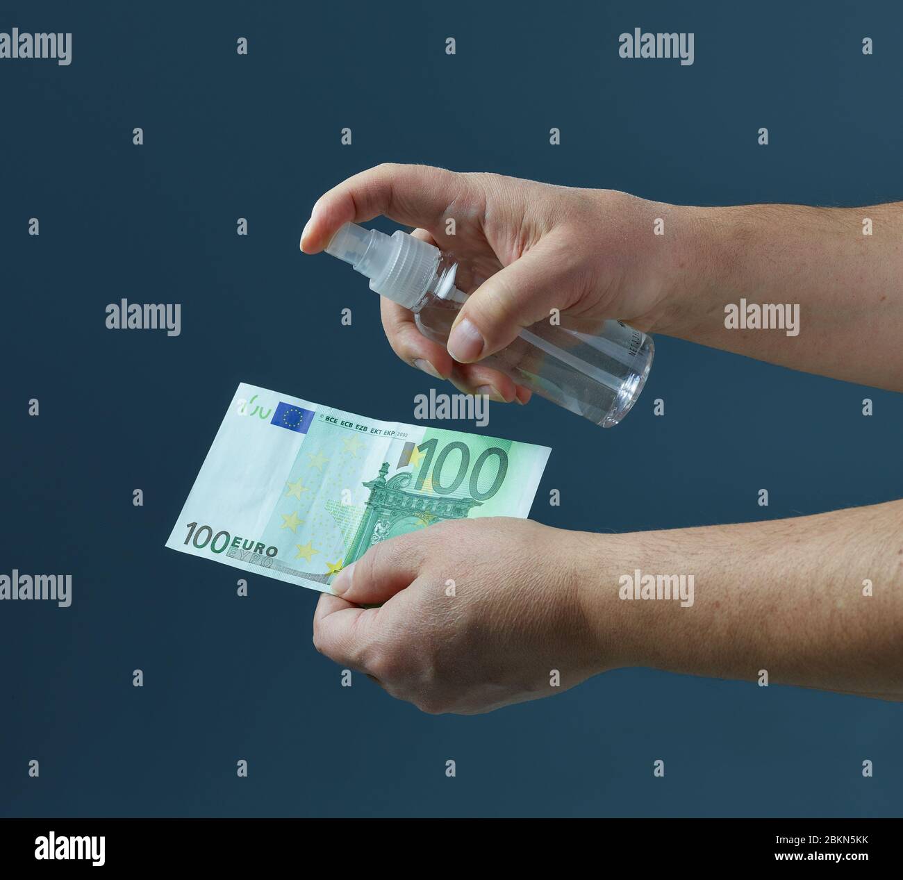 disinfection of money, banknote of 100 euros Stock Photo - Alamy